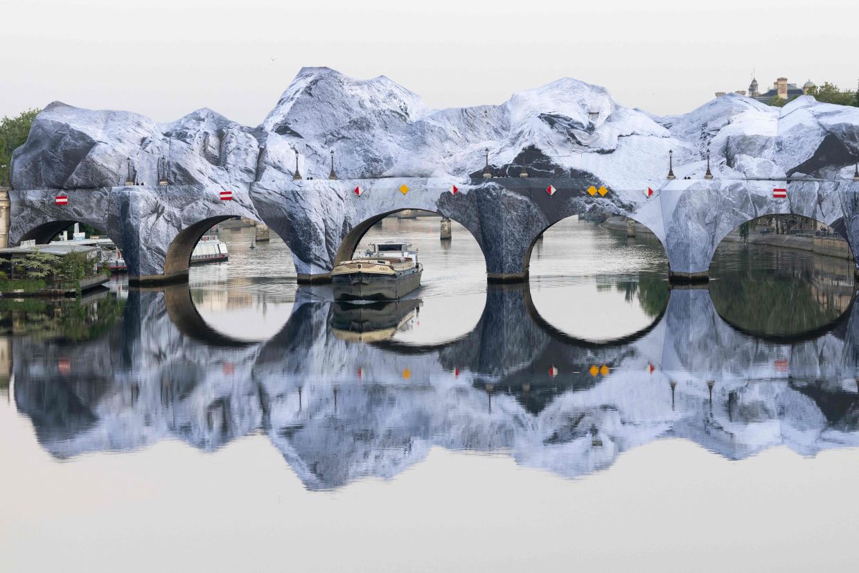 'French Banksy' and Daft Punk star turn Paris bridge into Alpine cave ...