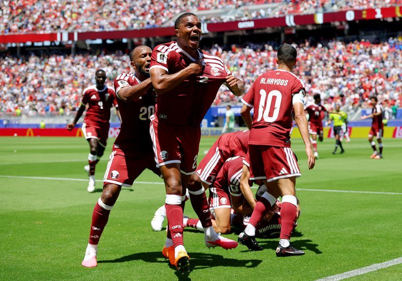 Football: Soccer-Qatar score late to clinch draw with stunned ...